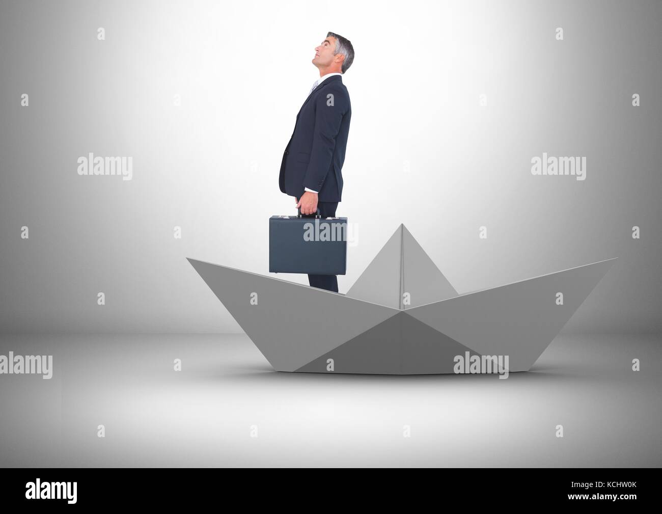 Digital composite of Businessman with briefcase in paper boat Stock ...