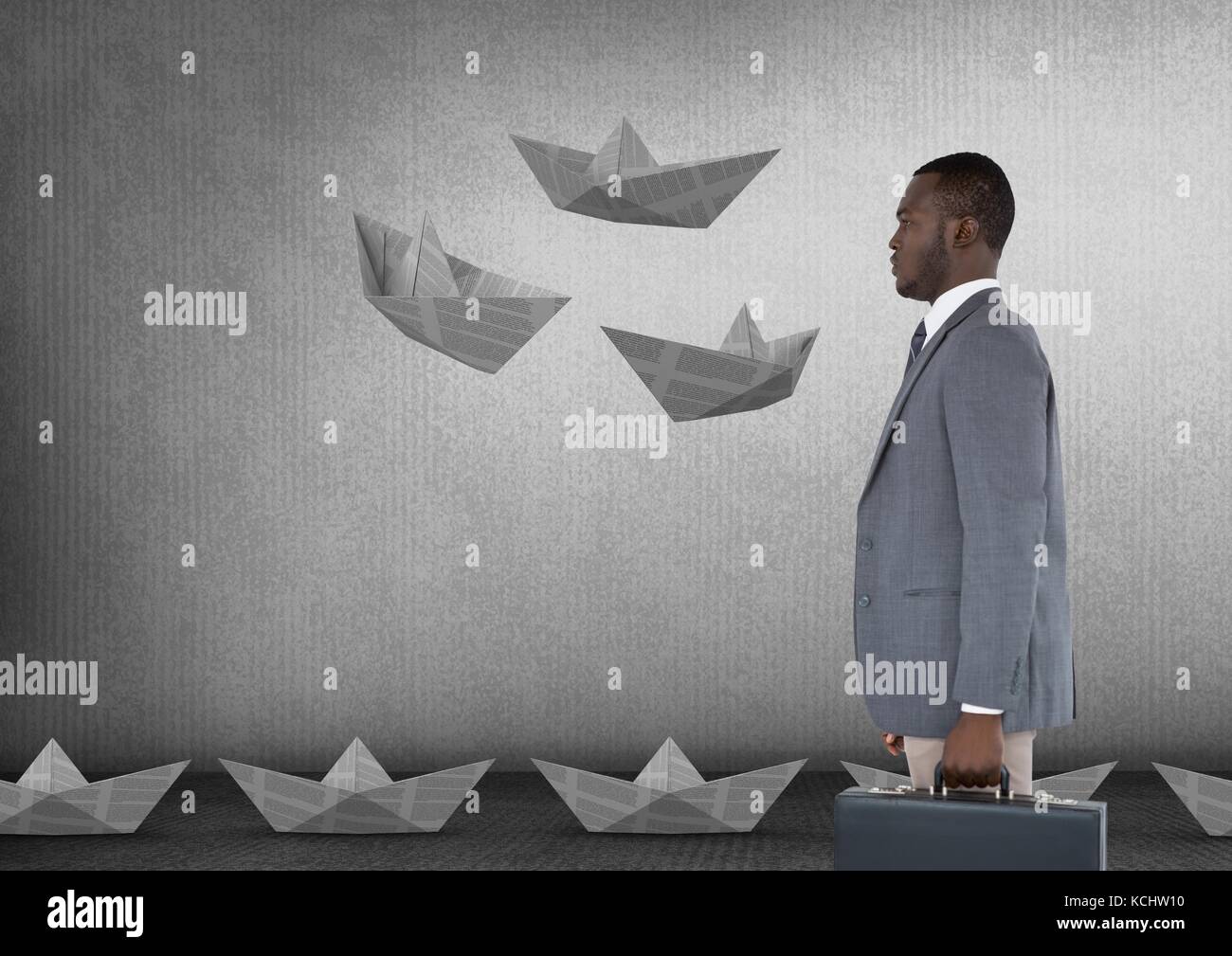 Digital composite of Businessman with briefcase and paper boats Stock ...