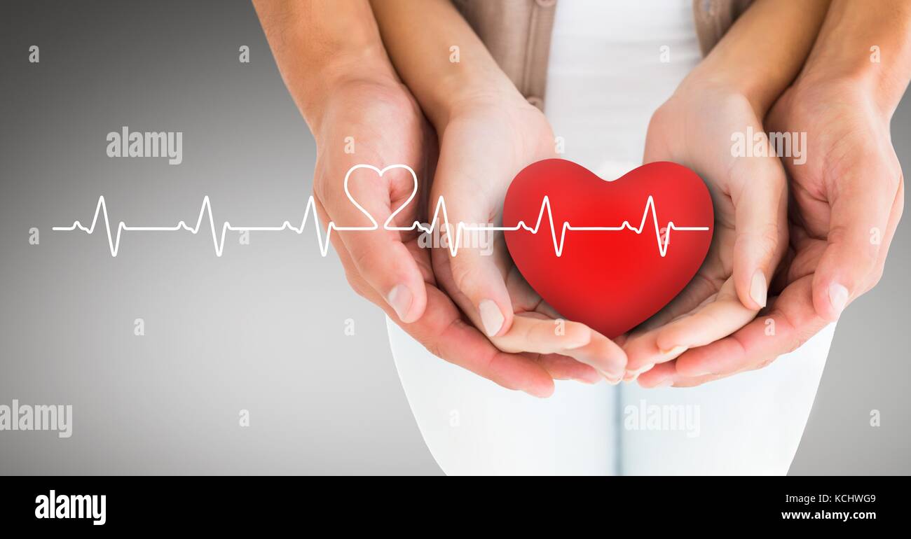 Digital composite of Heart beat over hands holding heart Stock Photo ...