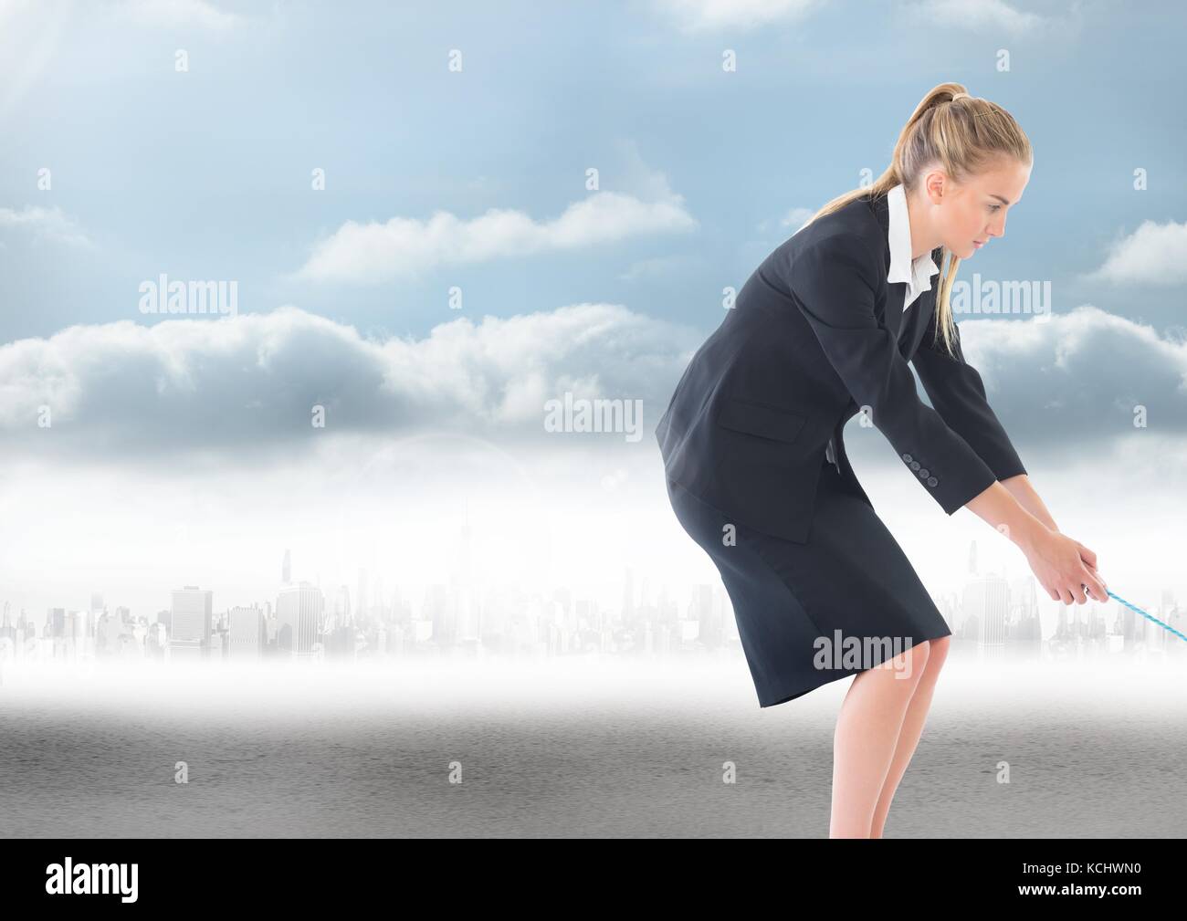 Digital composite of Businesswoman pulling rope over city Stock Photo ...