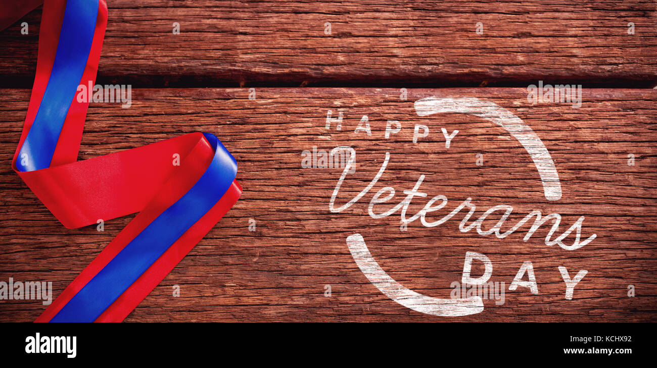 Logo for veterans day in america against red and blue ribbon on table ...