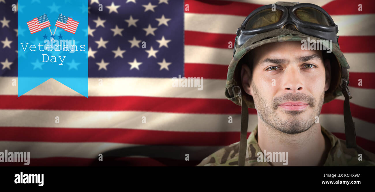 Close up of handsome soldier against logo for veterans day in america ...