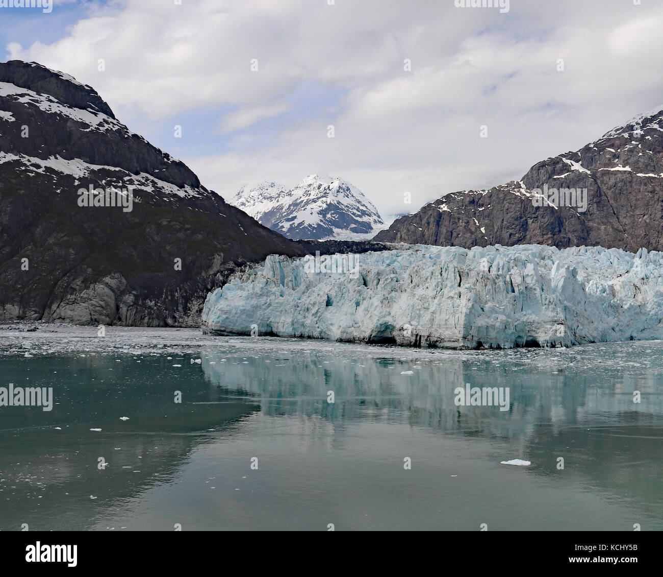 Margerie glacier in Tarr Inlet rests at the base of Mount Root and is ...