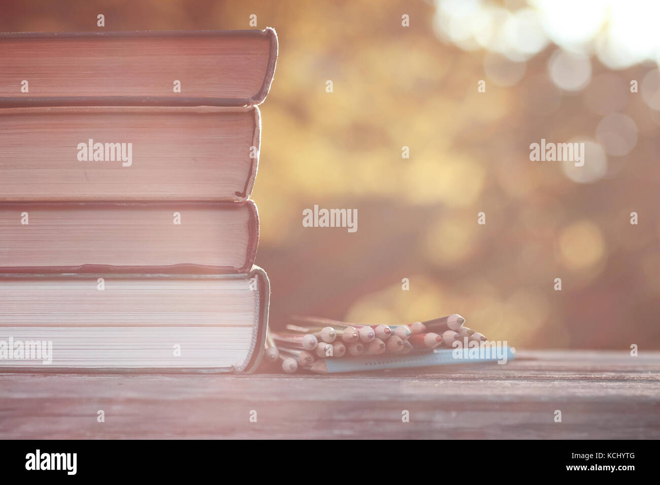 autumn book stack wooden outdoor Stock Photo - Alamy