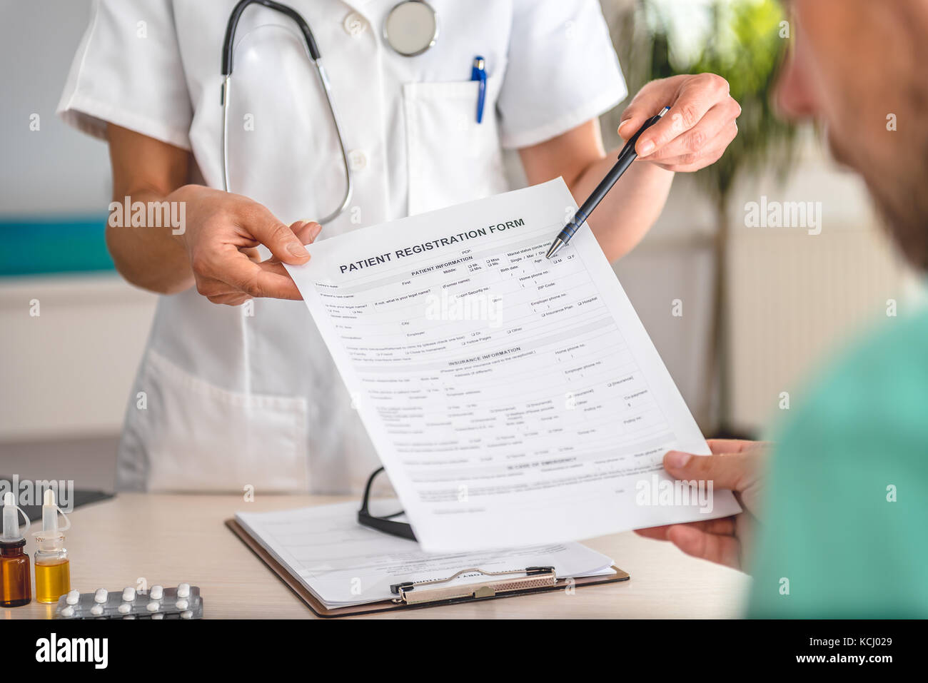 Hospital signing paperwork office hospital hi-res stock photography and ...