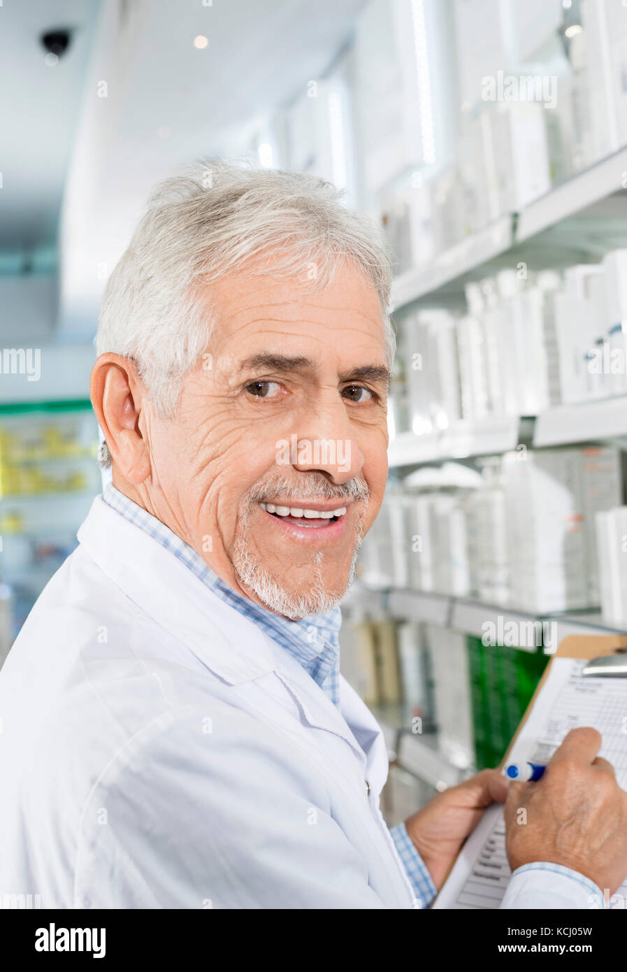 Smiling Senior Pharmacist Counting Stock In Drugstore Stock Photo - Alamy