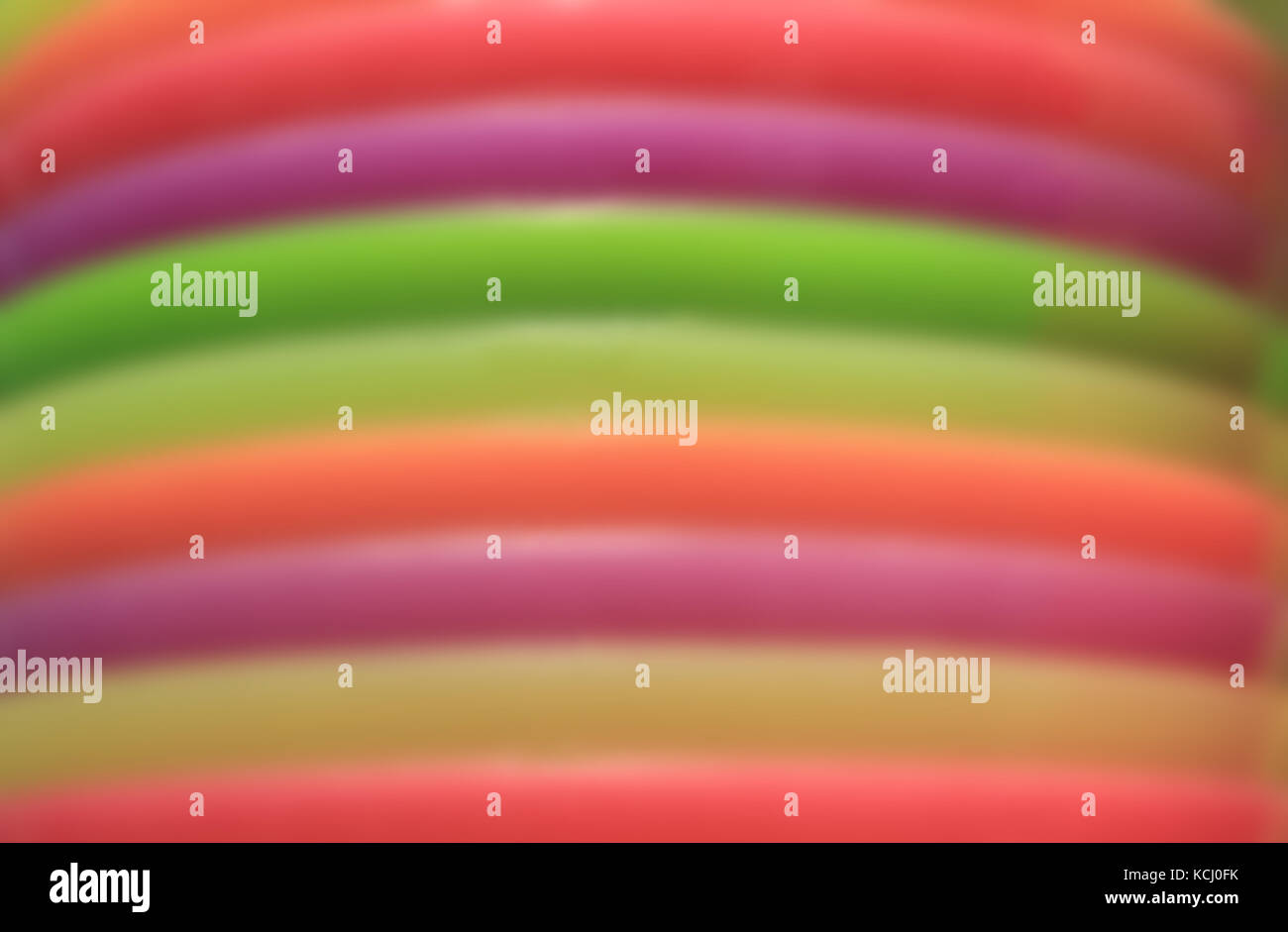 Abstract blurred photo of piled up colorful plates Stock Photo - Alamy