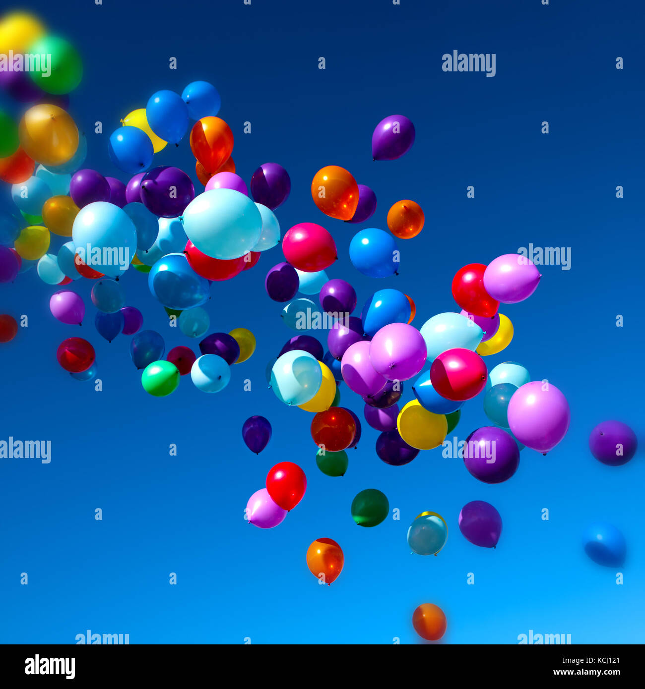 Colorful Balloons flying in the sky party Stock Photo - Alamy