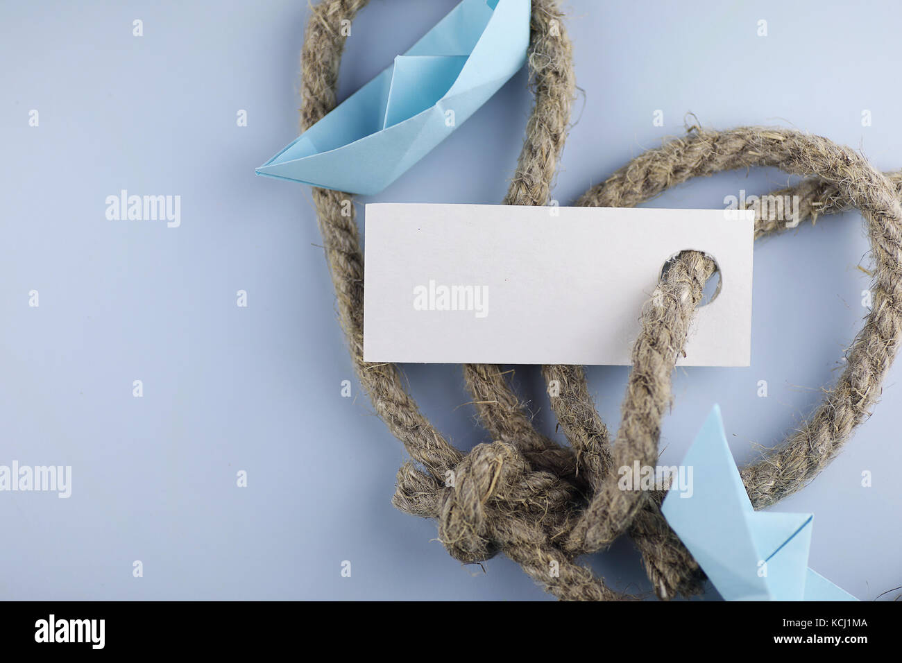 sticker with thick braided rope and ship paper origami Stock Photo - Alamy