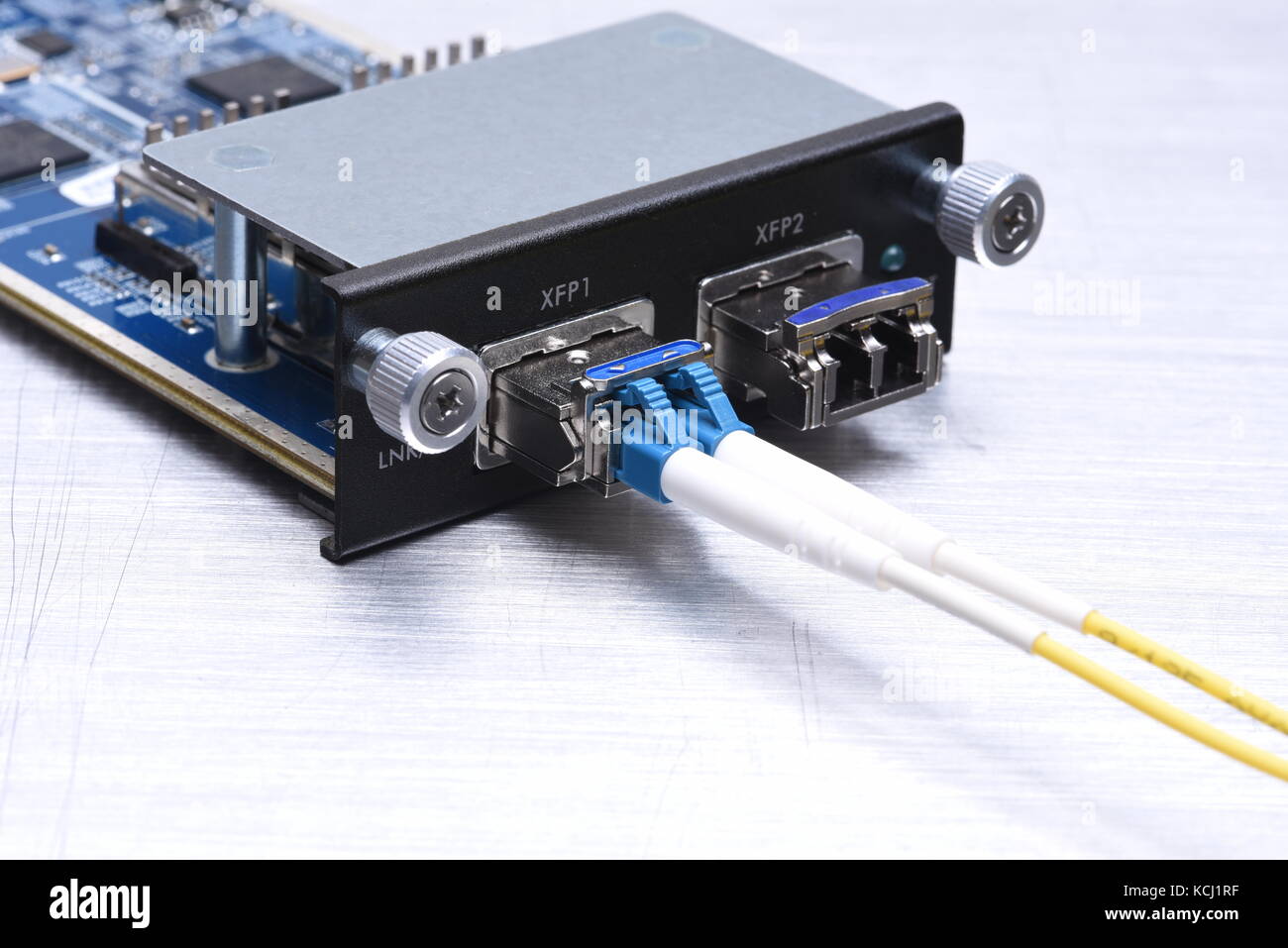 Gigabit interface converter type XFP with optical network cables on ...