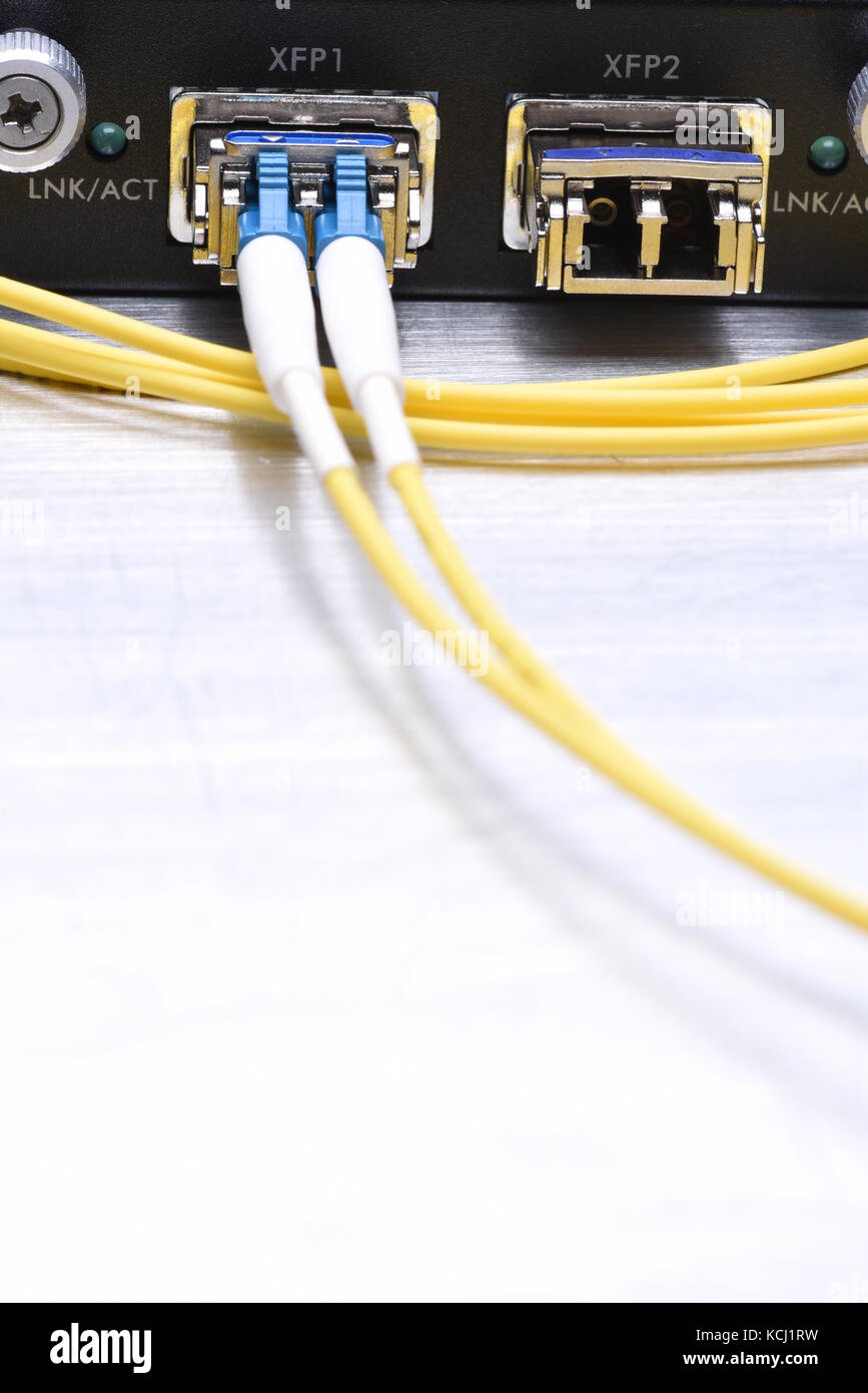 Gigabit interface converter type XFP with optical network cables on ...