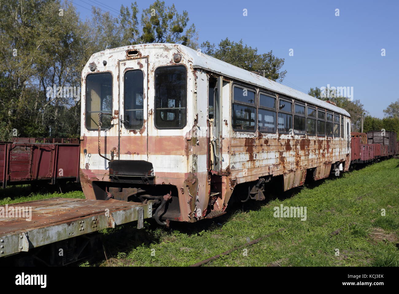 Old ruined steel passenger car. Rusty train on railway tracks Stock ...