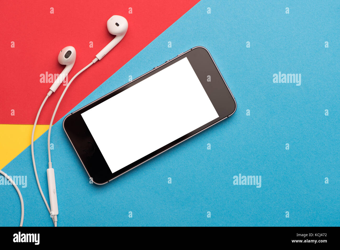 Mobile on colorful paper Stock Photo - Alamy