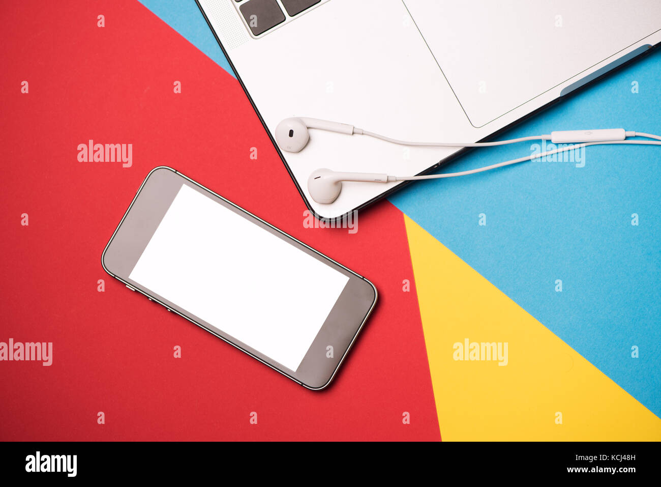 Mobile on colorful paper Stock Photo - Alamy