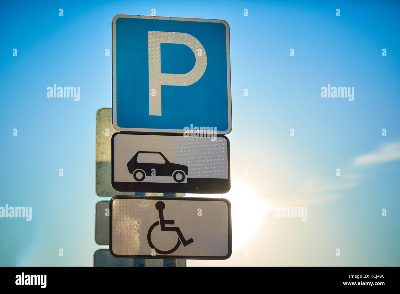 Parking for the disabled sign on a pole in an urban environment showing ...