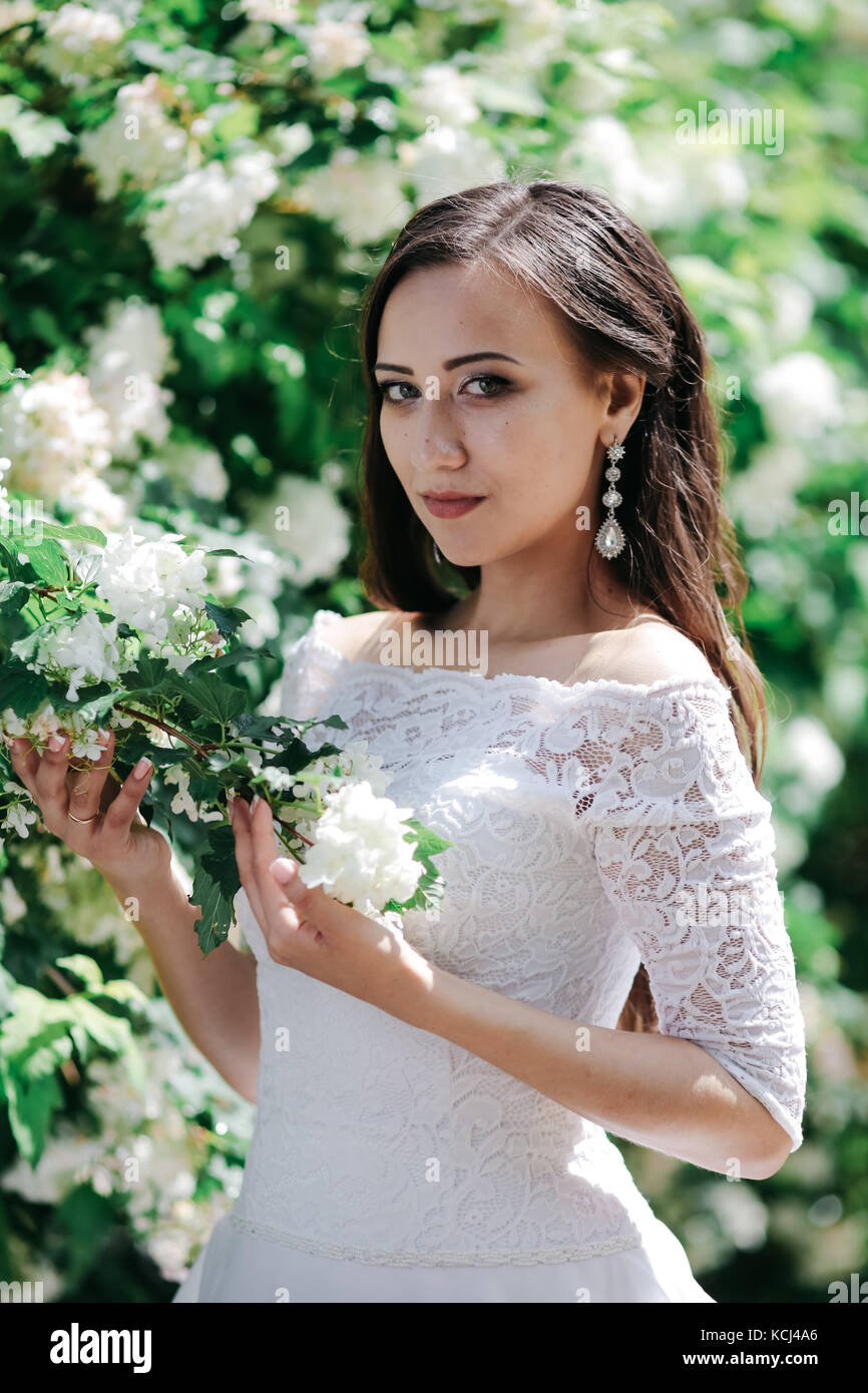 Beautiful bride stands near the lake and waits for the groom Stock ...