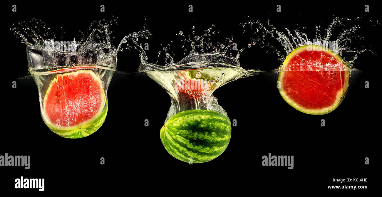 Fresh melon falling in water Stock Photo - Alamy