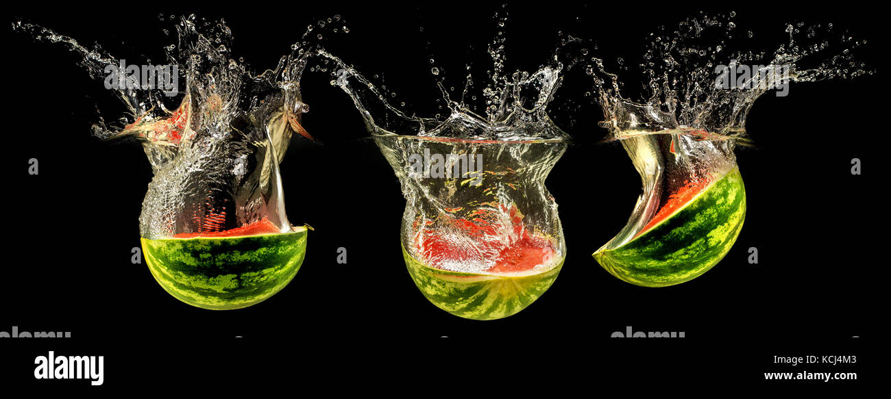 Fresh melon falling in water Stock Photo - Alamy