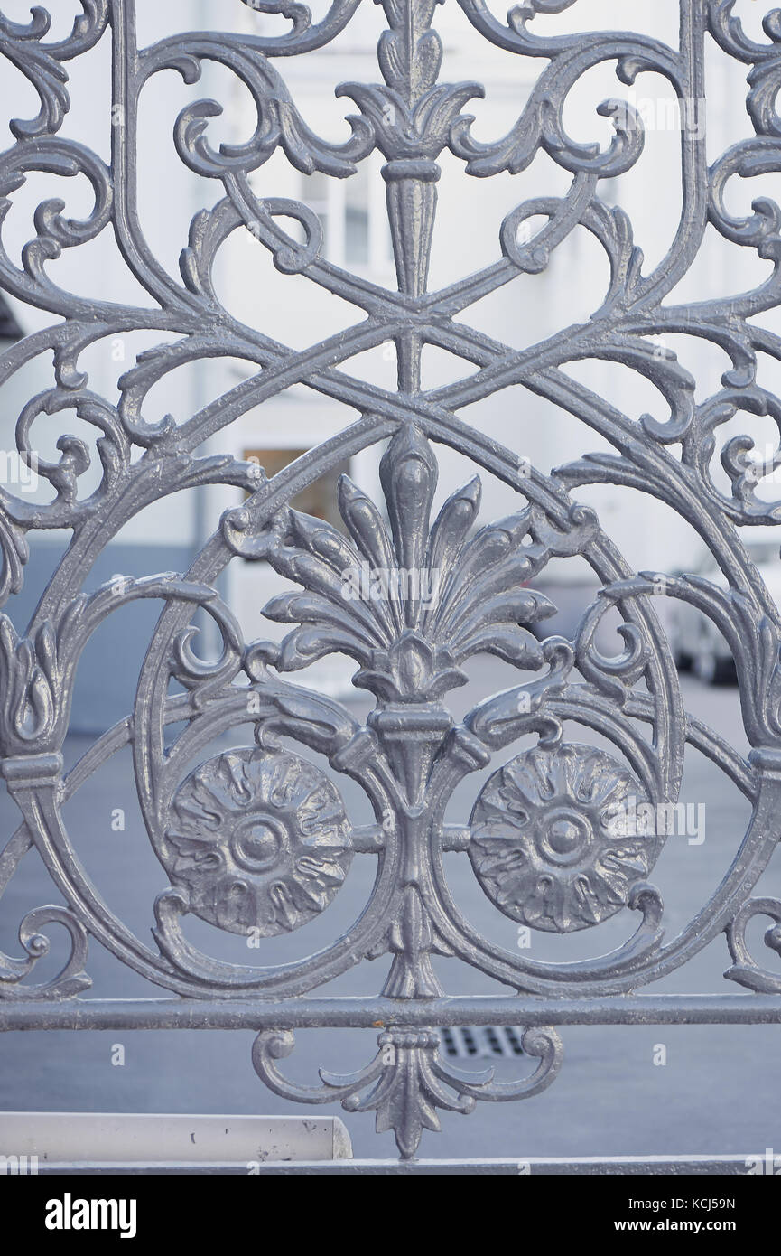 The texture of the wrought-iron grille on the window.Close. Artistic ...