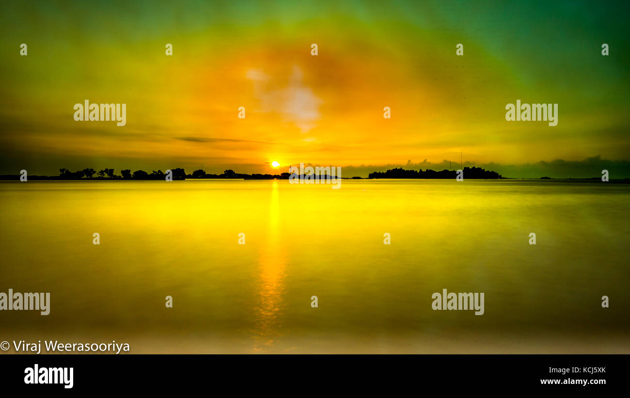 Sunset over the see Stock Photo - Alamy