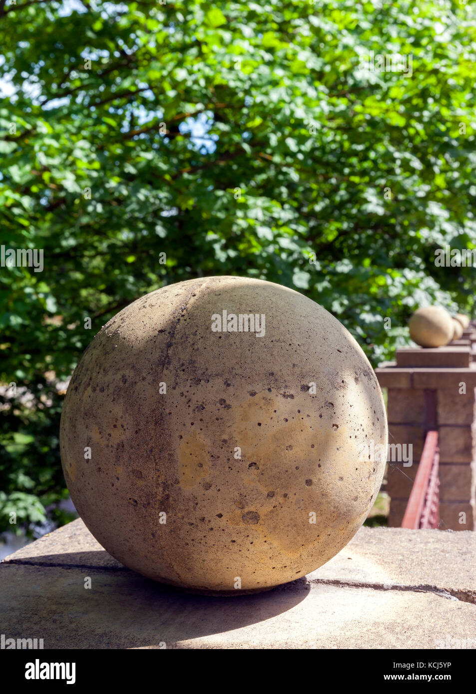 a stone ball to decorate the columns in the park. photo close up Stock ...
