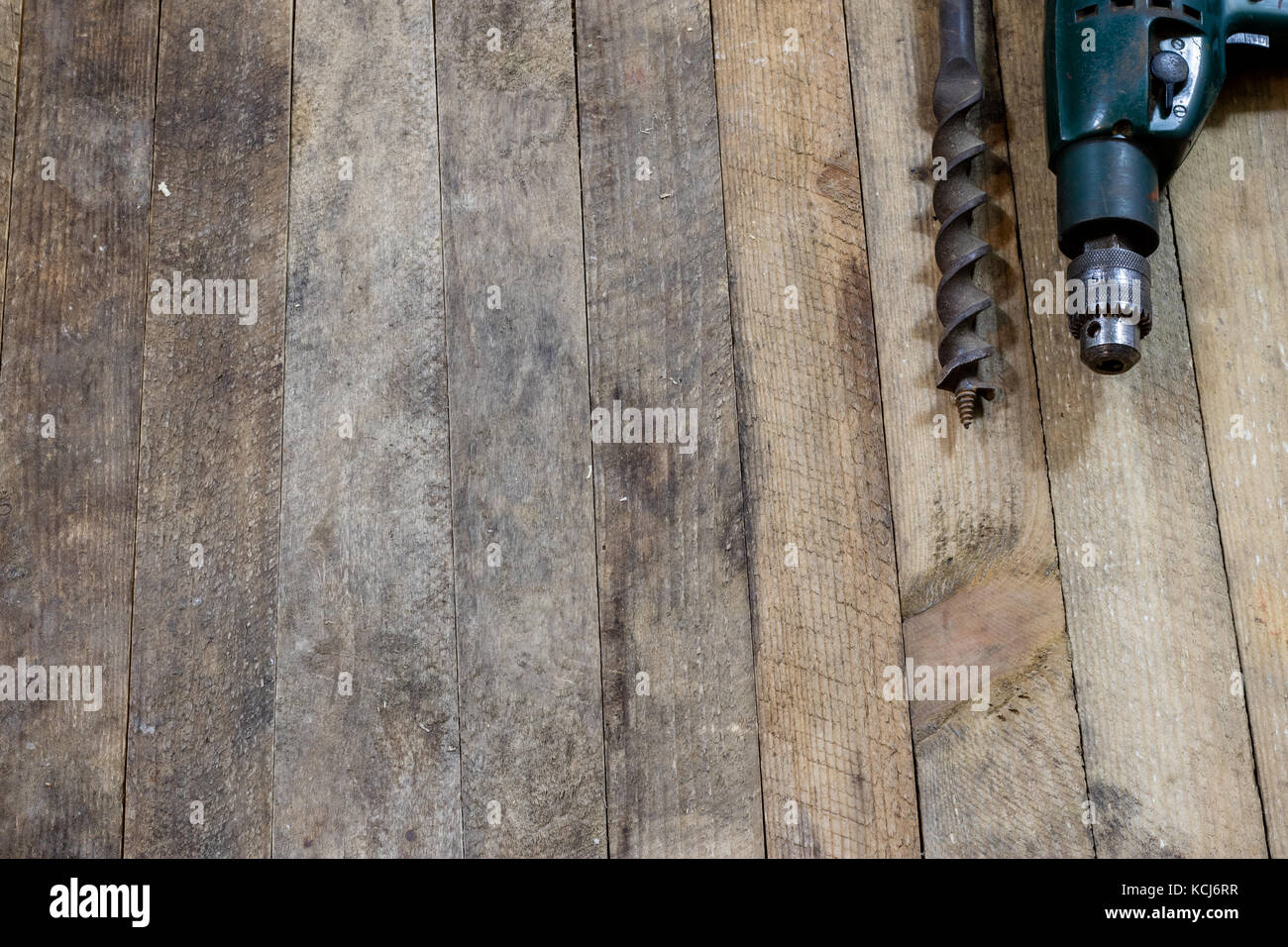 Tools on a wooden table in an old workshop. Arranged on the edge of the ...