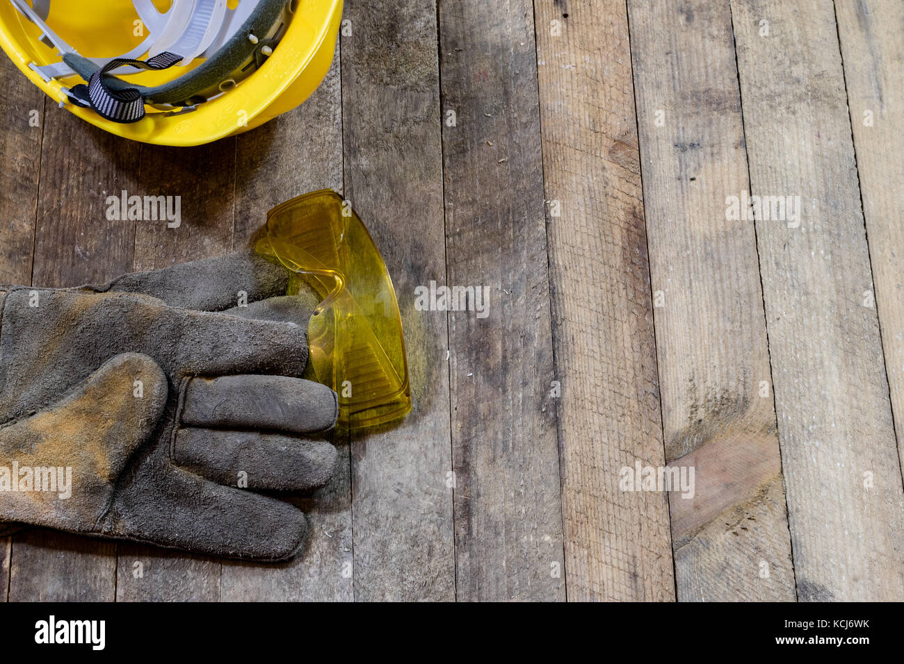 Tools on a wooden table in an old workshop. Arranged on the edge of the ...