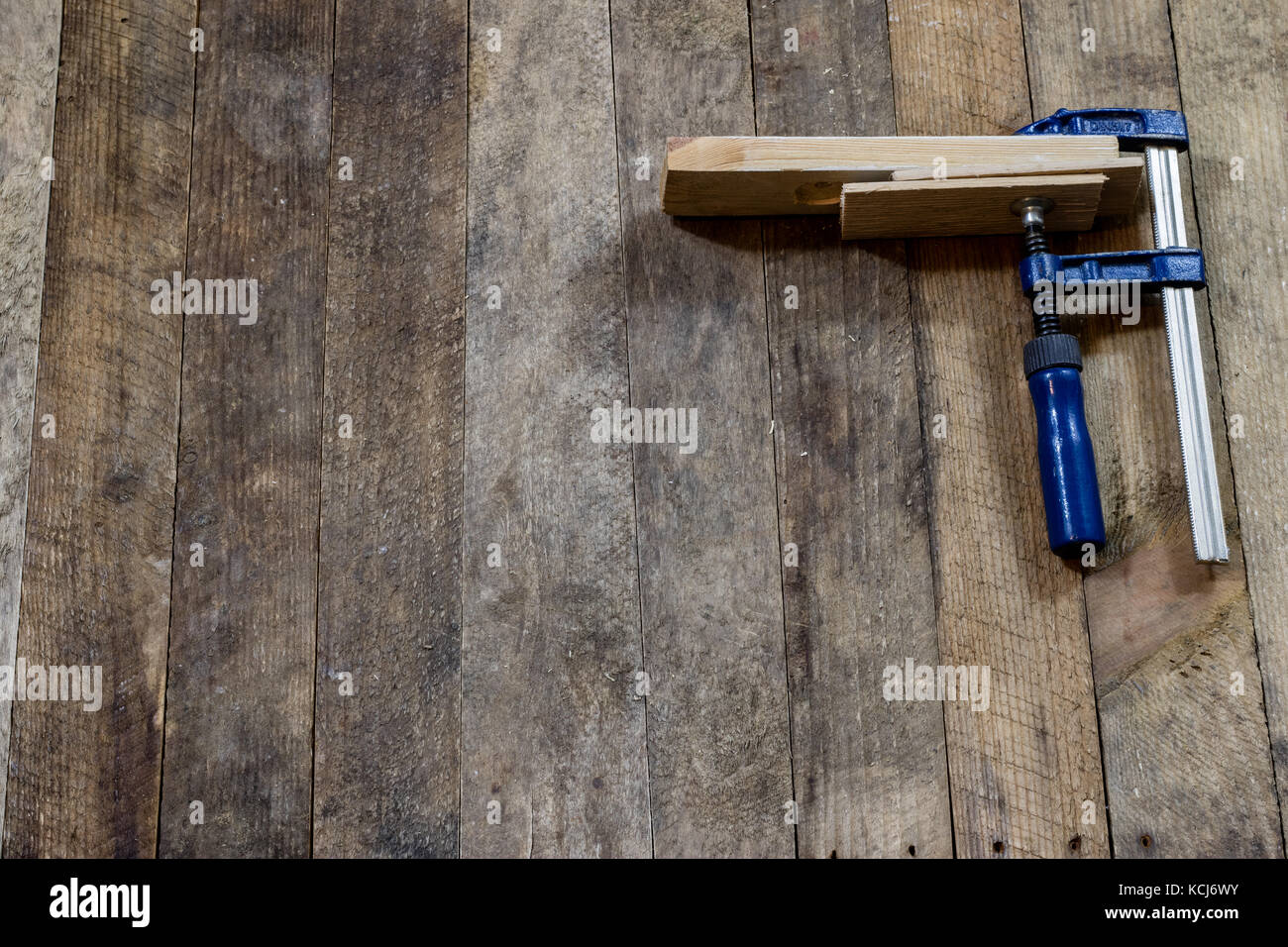 Tools on a wooden table in an old workshop. Arranged on the edge of the ...