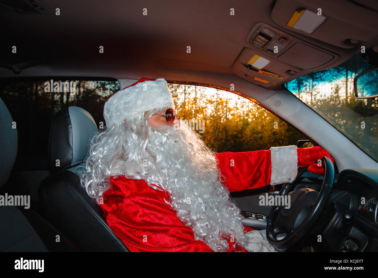 Authentic Santa Claus. Santa Claus drives a car through the autumn ...