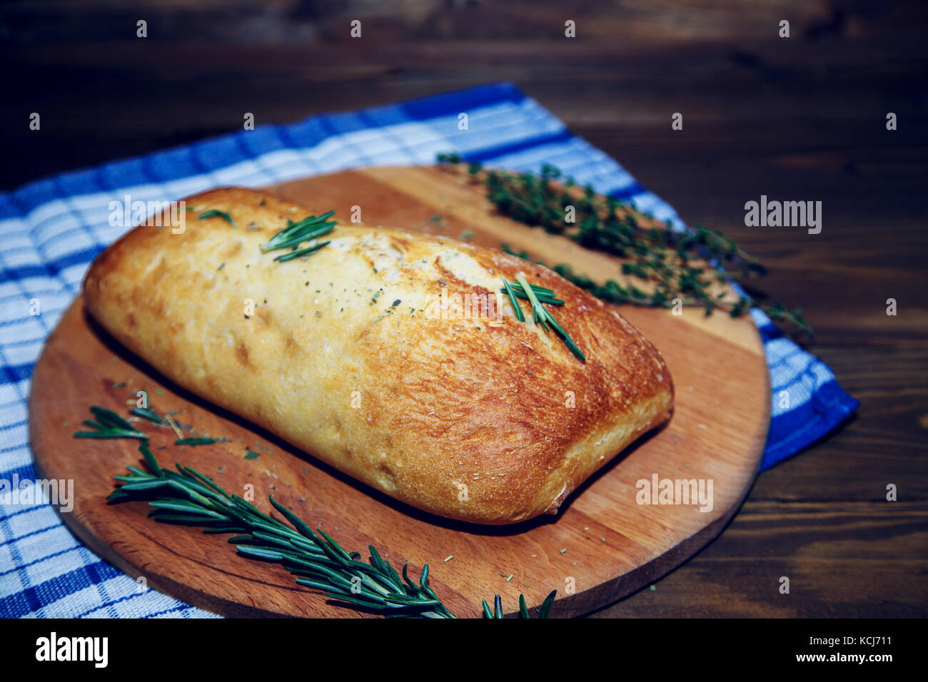 Traditional Italian ciabatta bread with herbs. Wooden background Stock ...