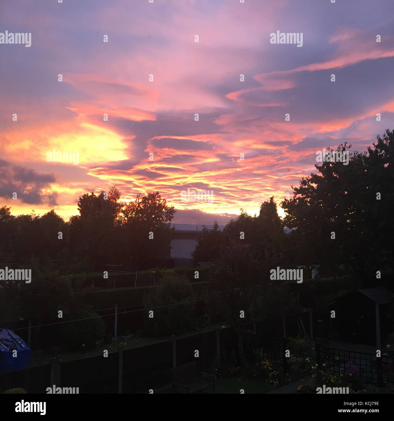 Red clouds at sunset in Derbyshire England Stock Photo - Alamy
