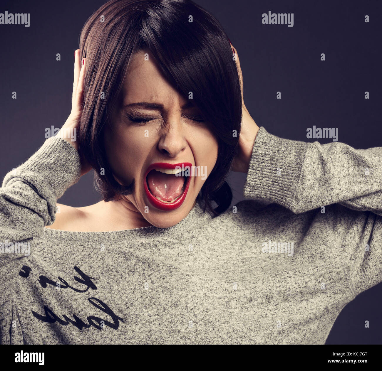 Shouting woman with unhappy, depressed crying face in big grief with ...
