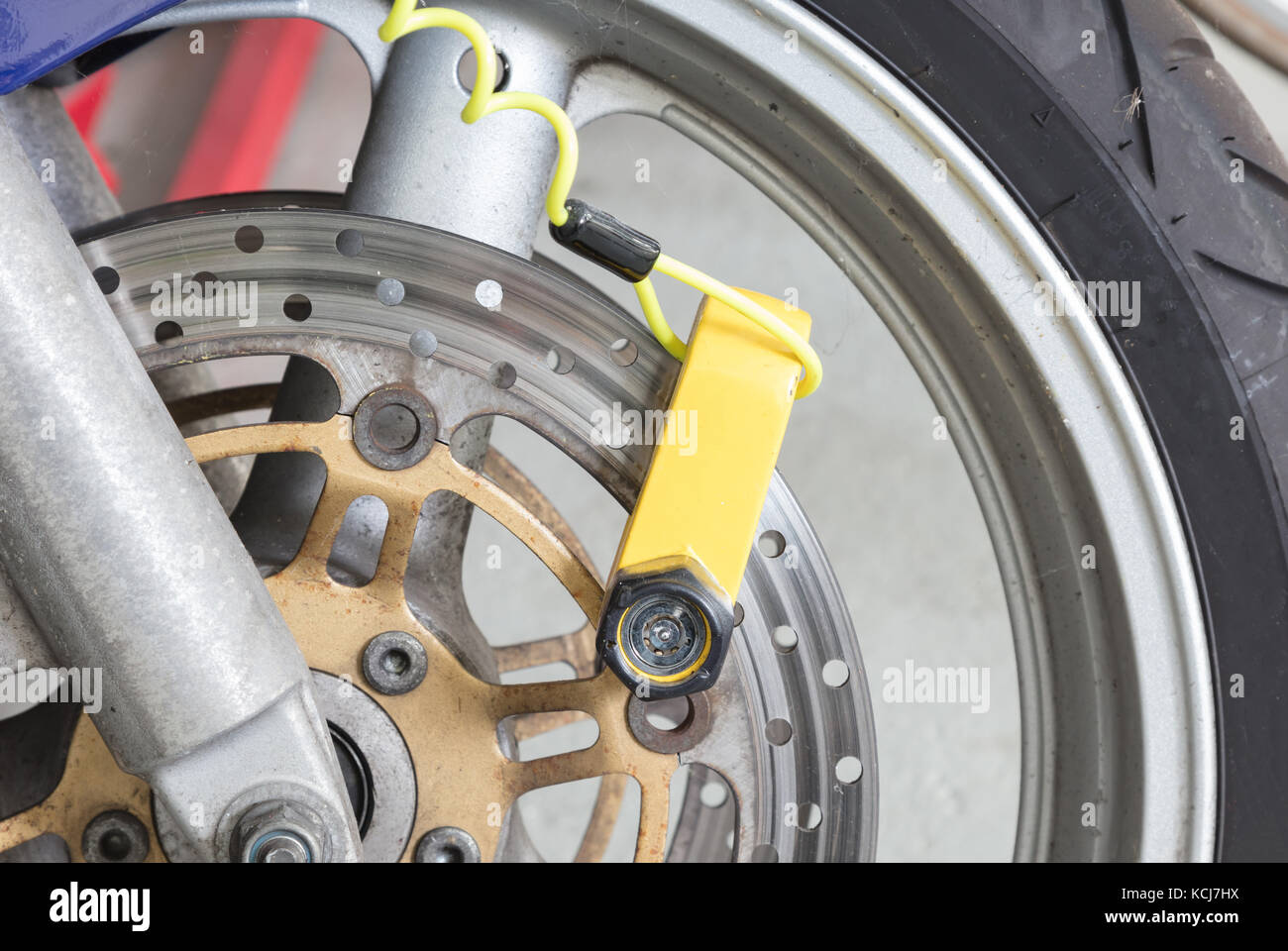 Security lock blocking the motorcycle front wheel - Selective focus ...