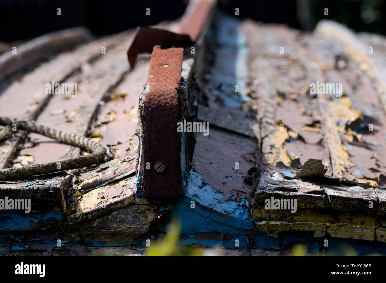 The rusty and decaying hull of a wooden boat, in need of attention ...