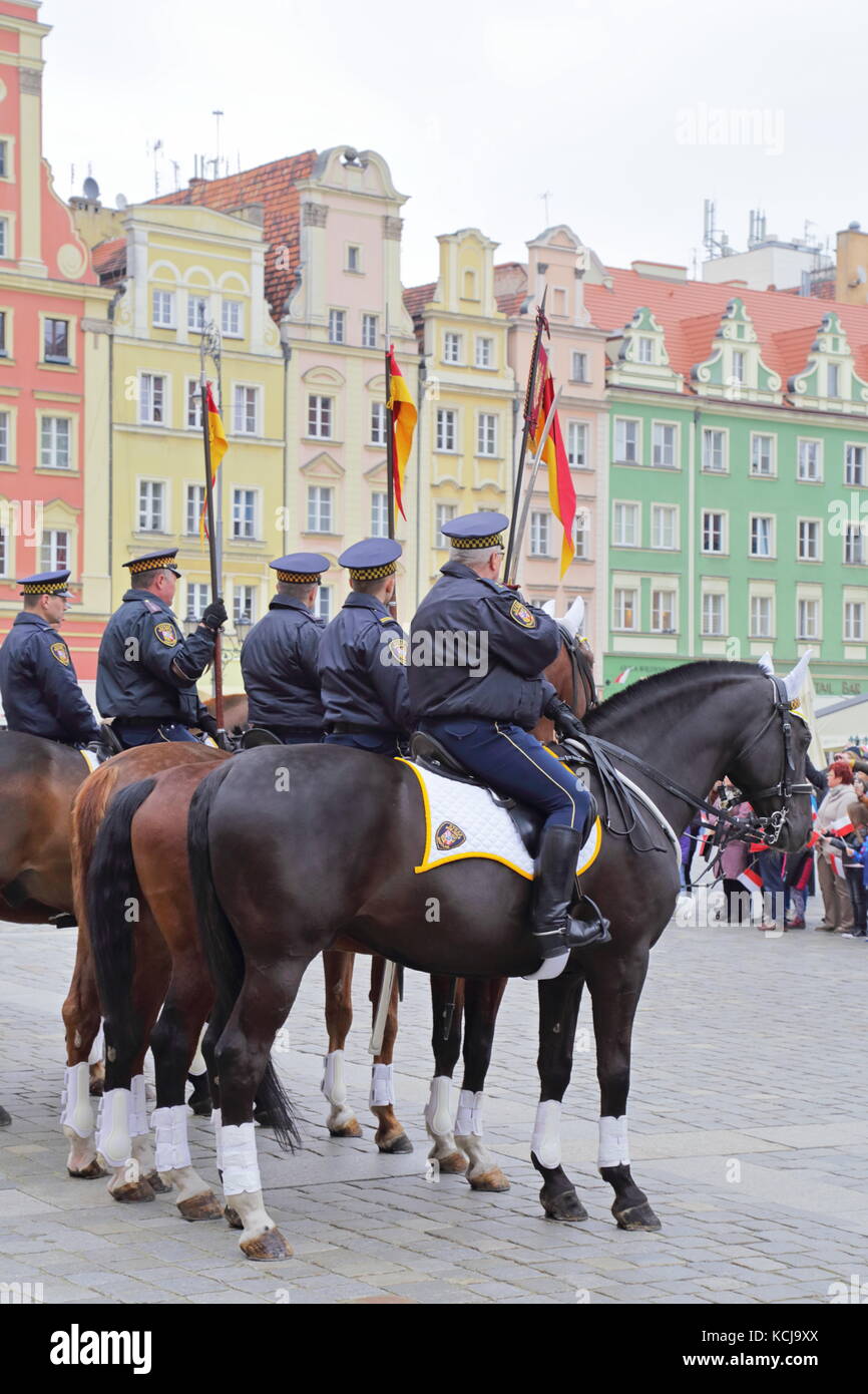 Officers of Polish city guard (Straz miejska) on horses on a parade ...