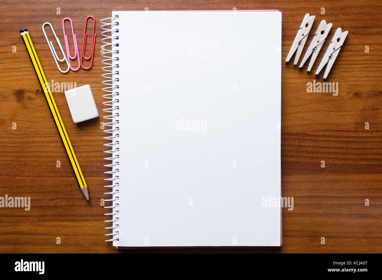 Pen, notepad and office objects on wooden table Stock Photo - Alamy