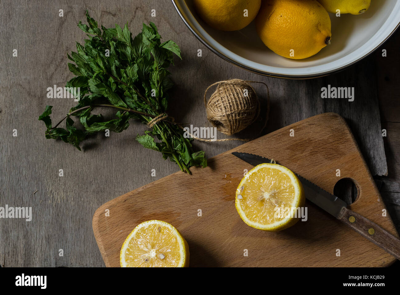 Making lemonade from lemons and mint Stock Photo - Alamy