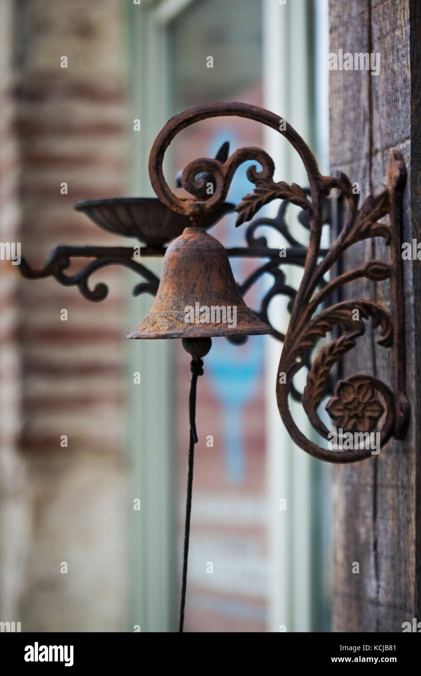 Bronze bell at the door of a house Stock Photo - Alamy