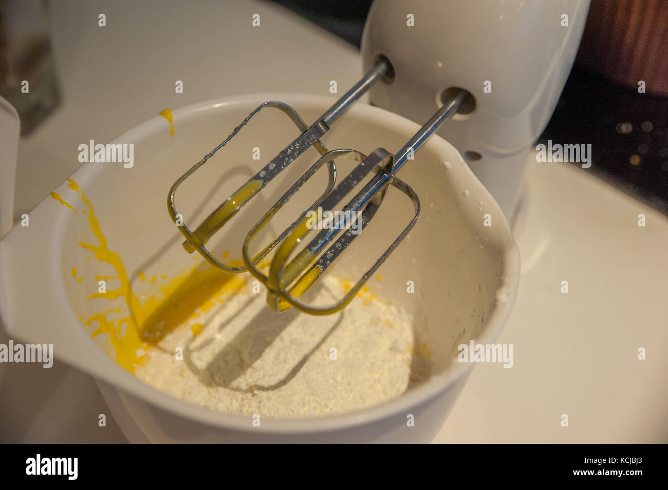 White kitchen mixer, mixing eggs and flour Stock Photo - Alamy