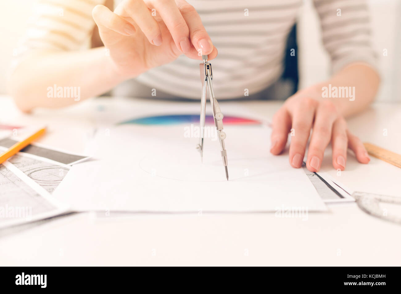 Pair of compasses being used for a drawing Stock Photo - Alamy