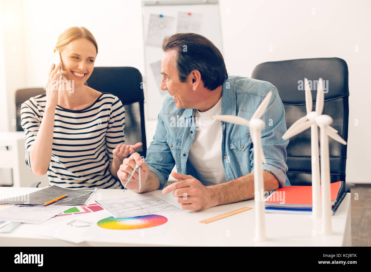Happy positive engineers working together Stock Photo - Alamy