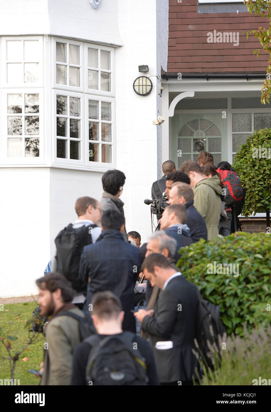 Members of the media queue outside the London home of British author ...
