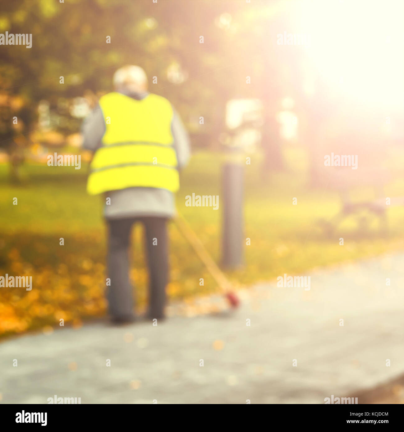 Abstract blurred background - road sweeper worker cleaning city street ...