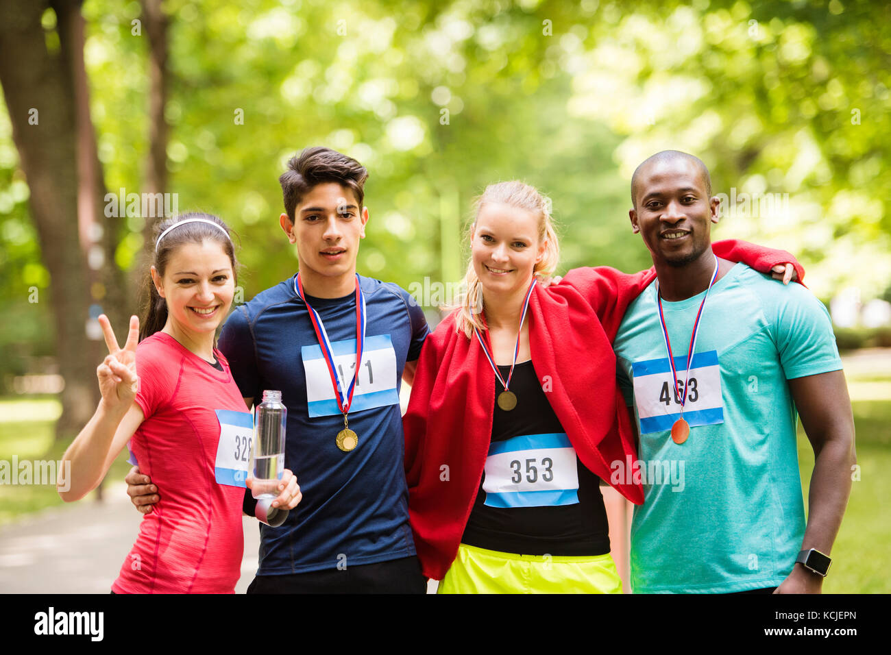 Group of young fit friends happy after finishing race Stock Photo - Alamy