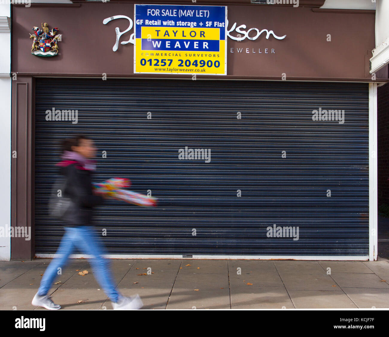 Out of focus figures passing, Businesses in decline, Prime Location ...