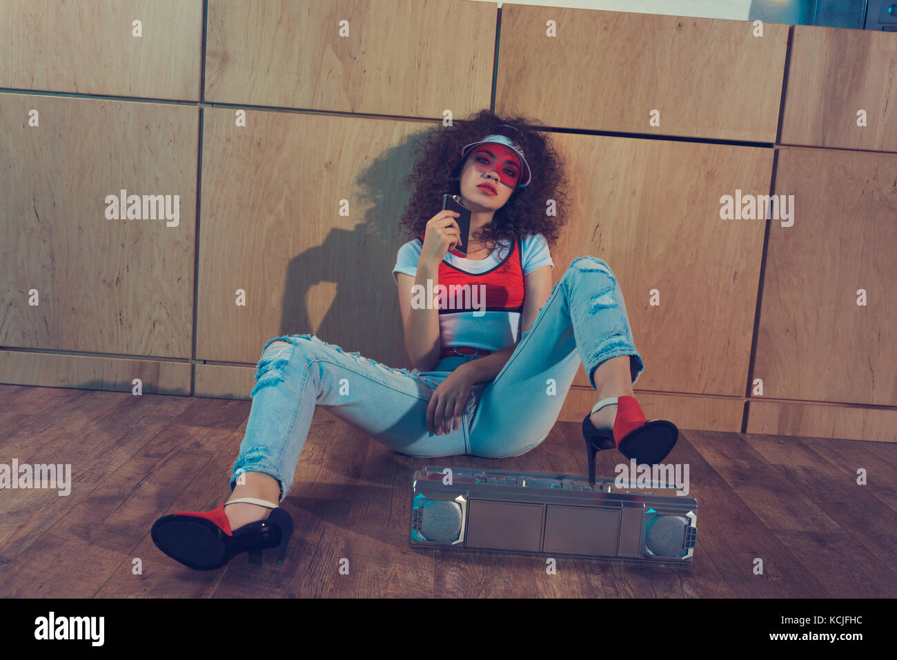 fashionable woman with hip flask Stock Photo - Alamy