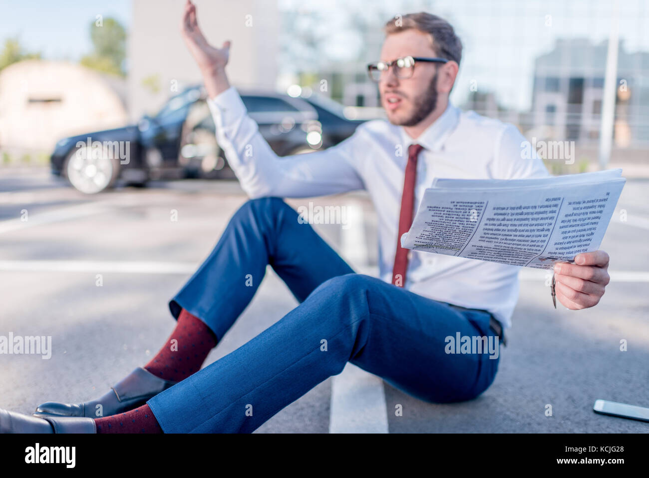 stressed businessman with newspaper Stock Photo - Alamy