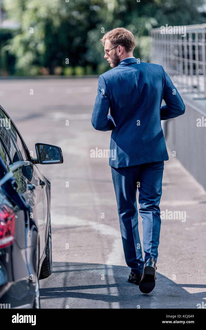 businessman in suit at car Stock Photo - Alamy