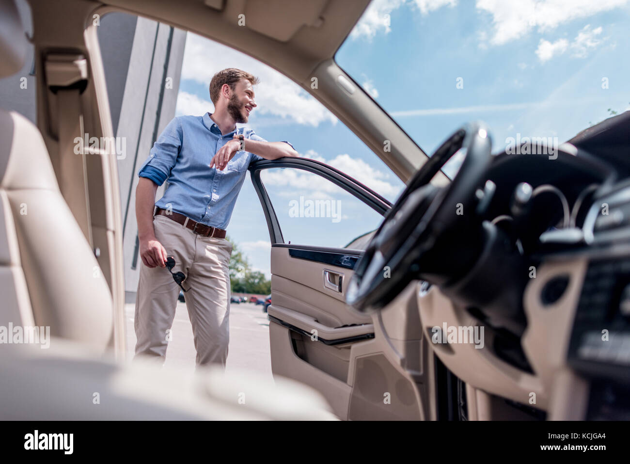 man standing near the car Stock Photo - Alamy