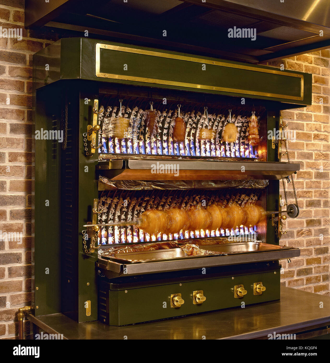 Chickens turning and grilled on the Roaster machine Stock Photo - Alamy